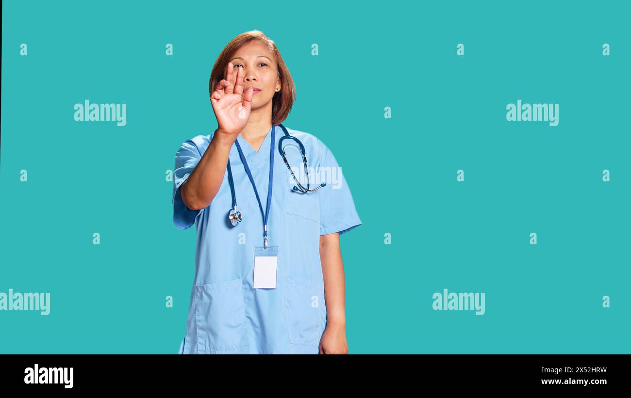 Nurse doing swiping hand motions hi-res stock photography and images ...