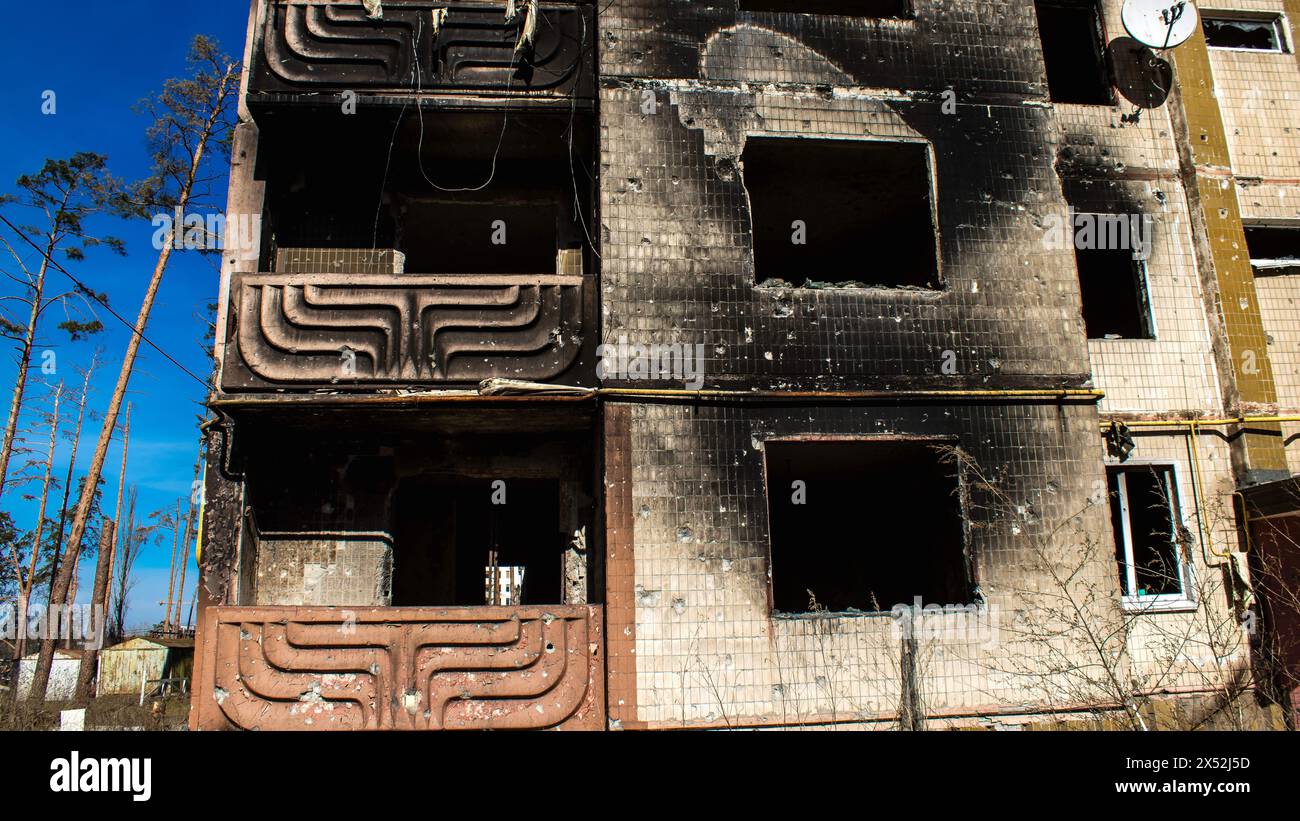 Close-up of the windows of the facade of a building that burned after ...