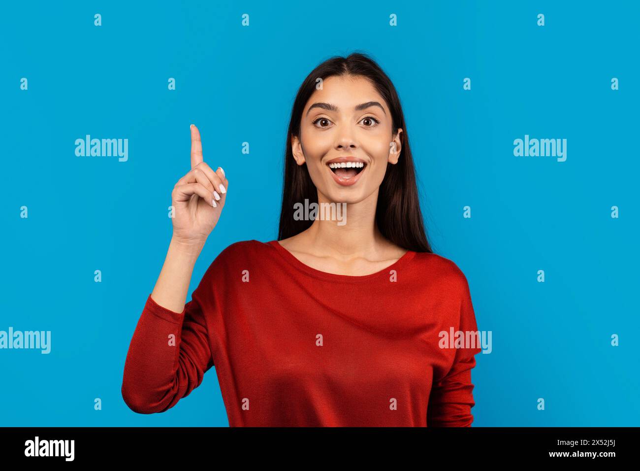 Woman in Red Shirt Pointing Finger up Stock Photo - Alamy