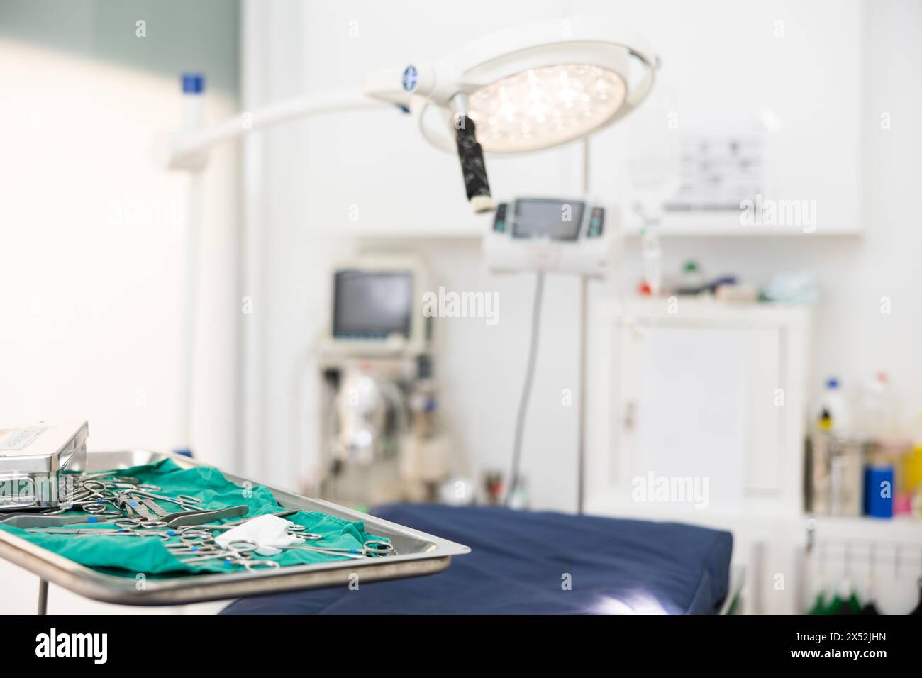 Veterinary operating room with sterile instruments, surgical table and ...