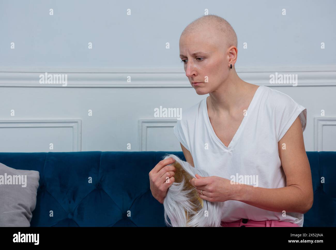 Sad middle aged woman cancer survivor holds wig in her hands Stock ...