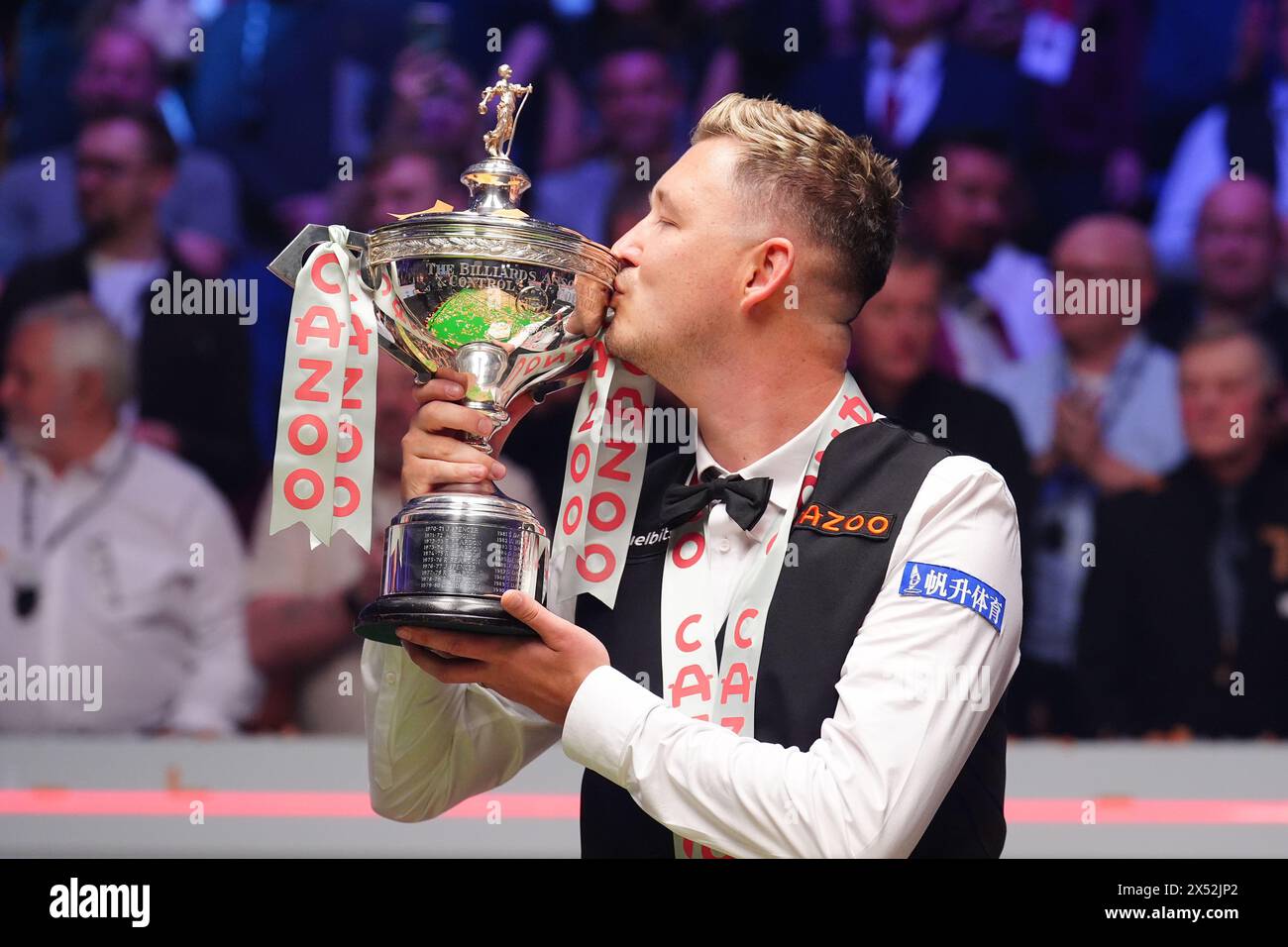 Kyren Wilson celebrates with the trophy after winning the final on day ...