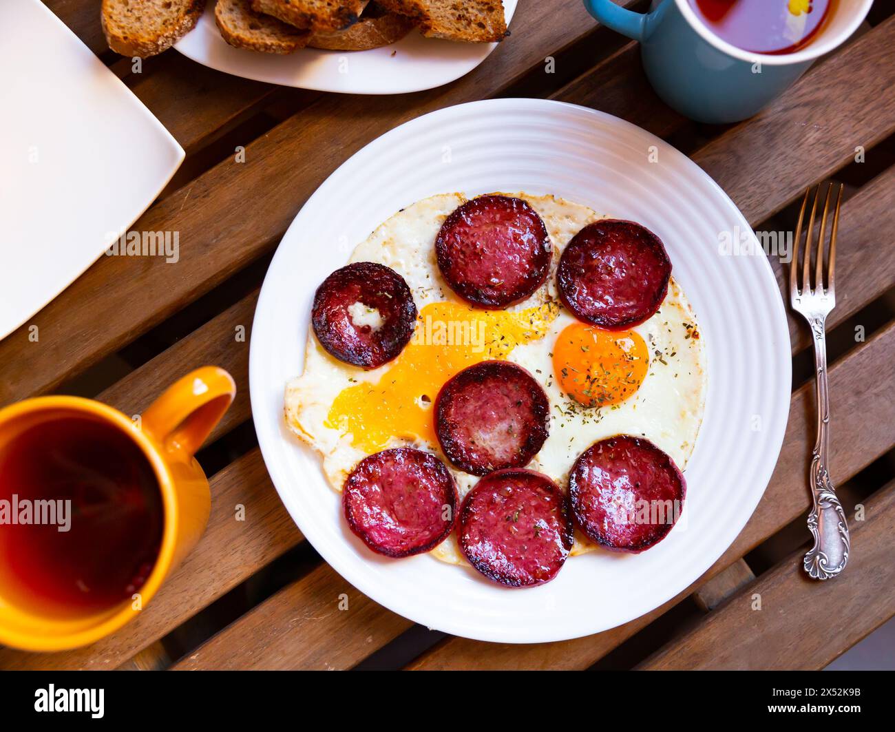Fried smoked sausages slices Stock Photo - Alamy