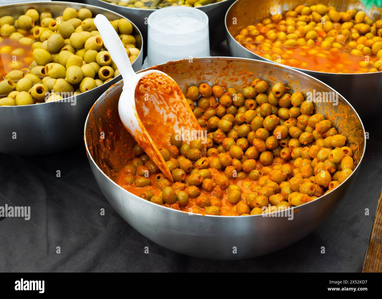 Pile of pitted green olives in bucket Stock Photo - Alamy