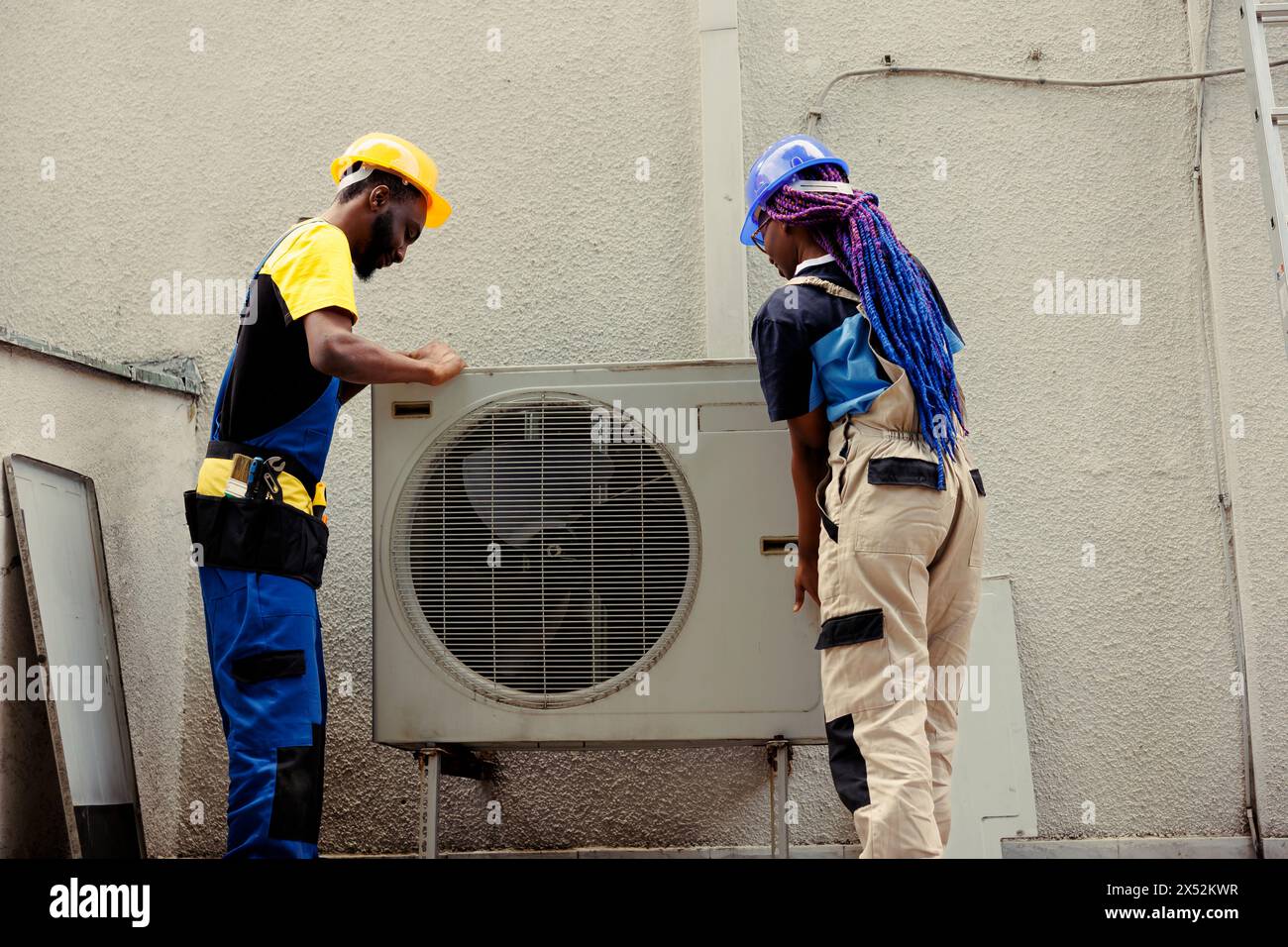 Certified engineers dismantling hvac system panel with industry ...