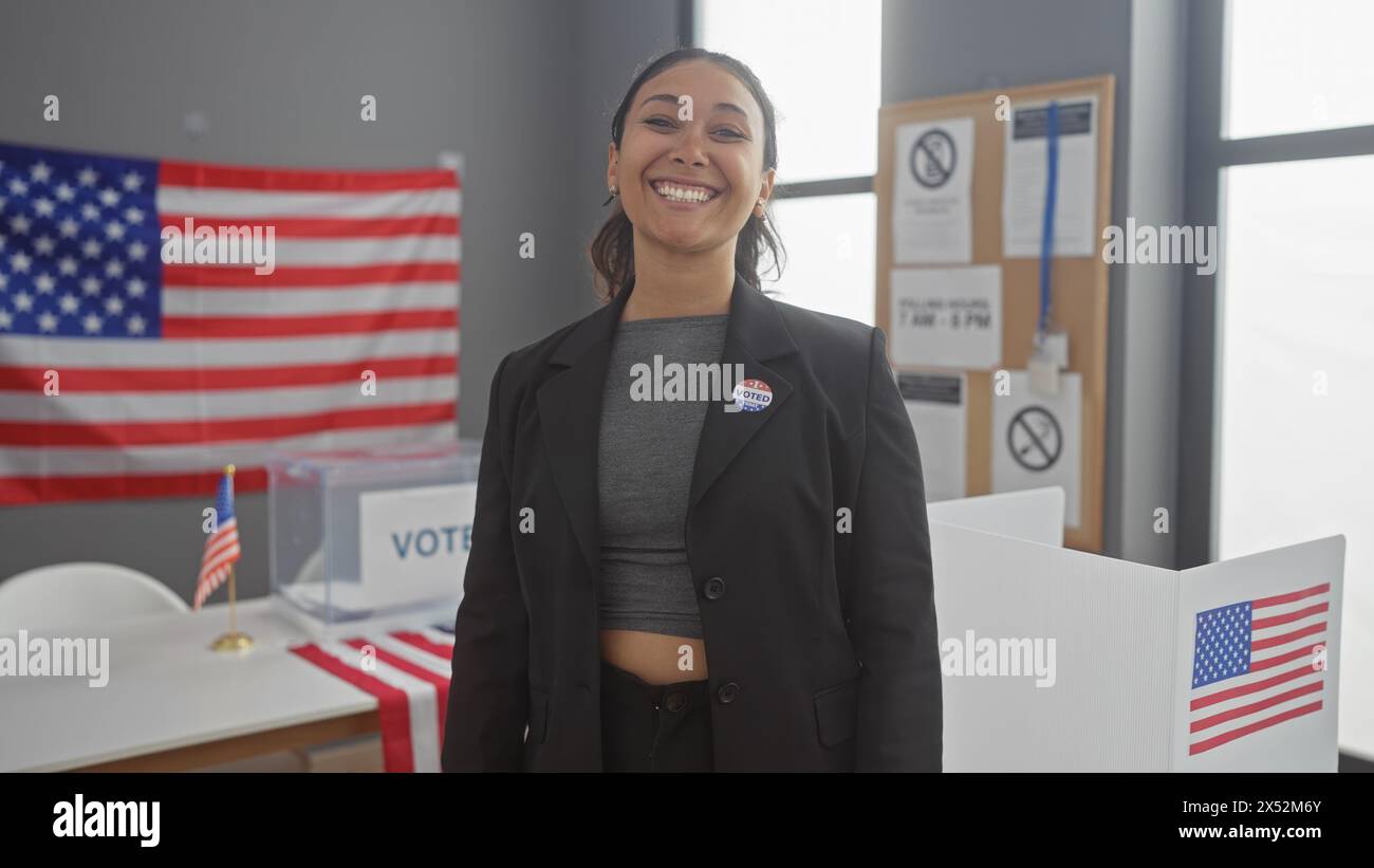 A smiling young hispanic woman with an 'i voted' sticker stands in a ...