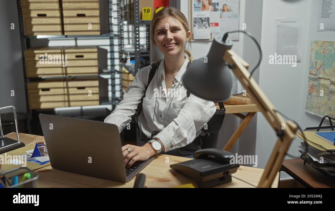 Smiling woman detective in office with laptop, evidence boxes, map, and ...