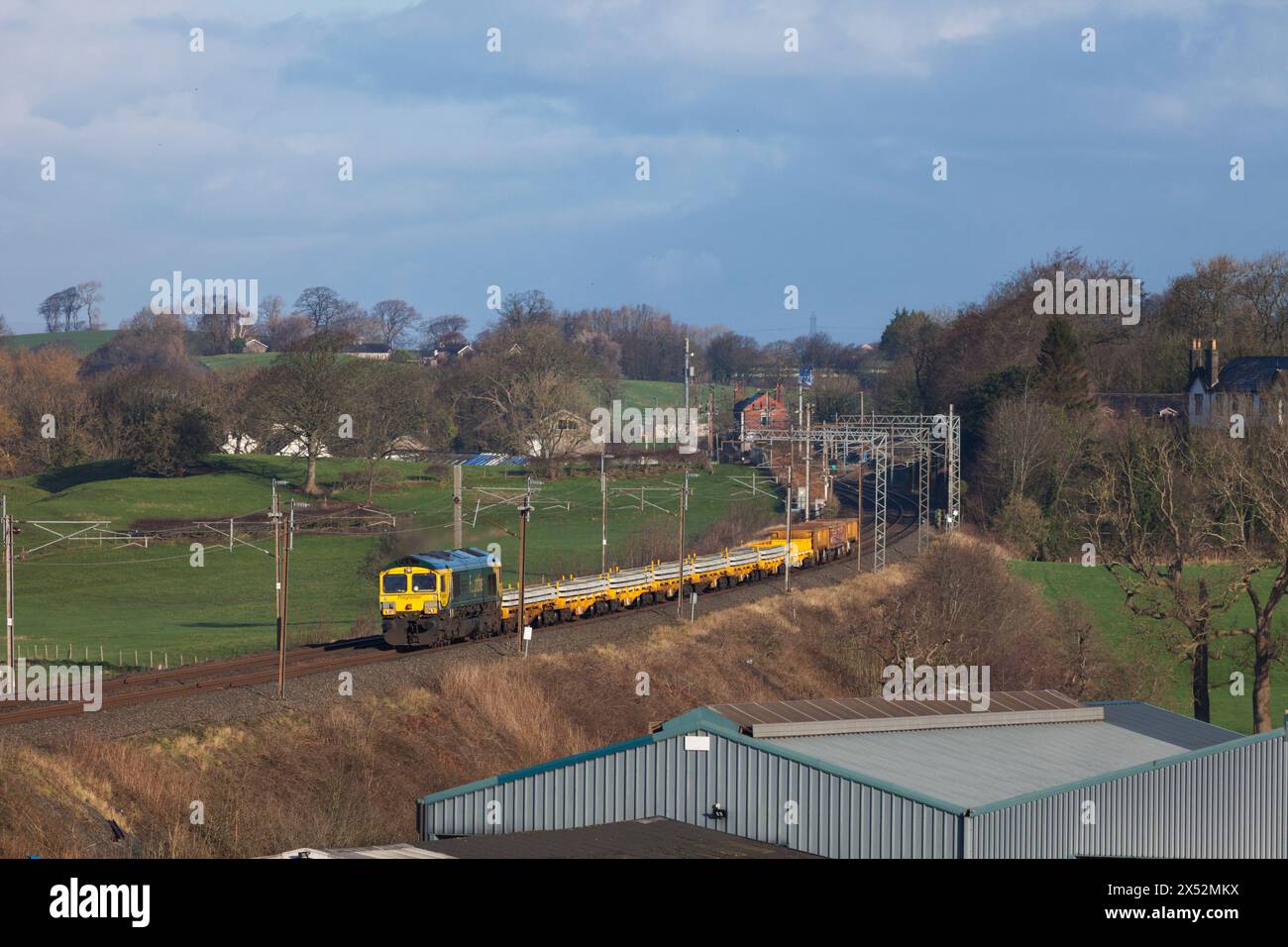 Freightliner Class 66 locomotive passing bay Horse on the west coast Mainline with a train ...