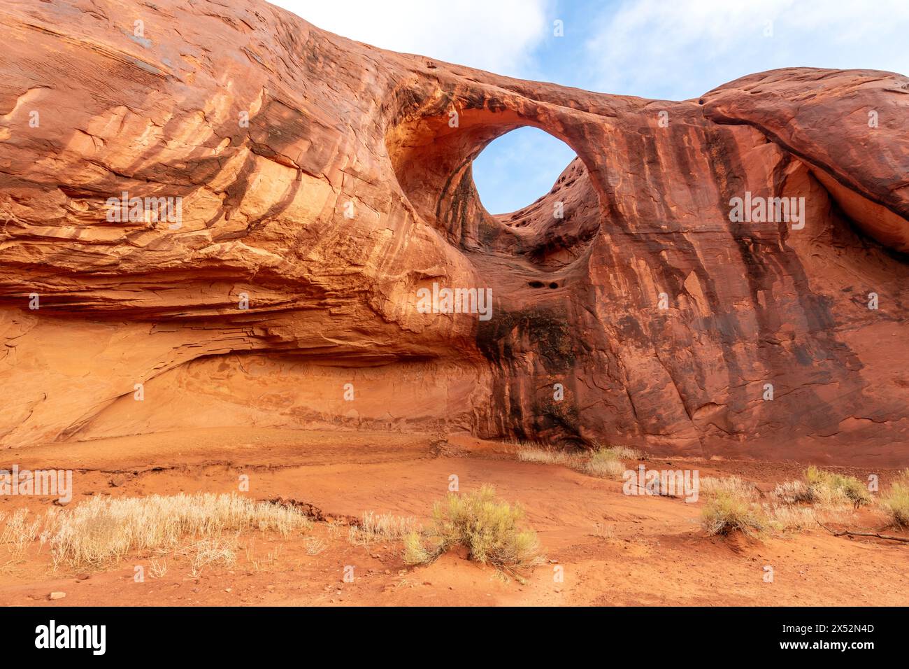 Eye of the Sun Arch in Monument Valley shows the water and wind effect ...