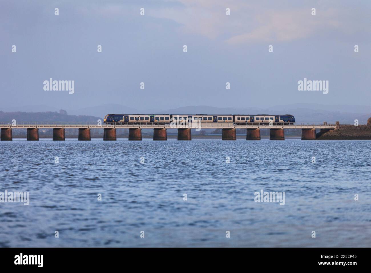 Northern rail class CAF 195 train crossing Arnside viaduct across the ...