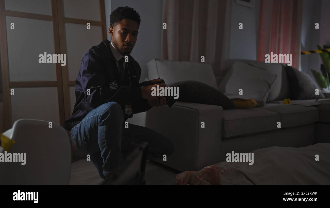 A serious black detective examines evidence with a camera at a dimly ...