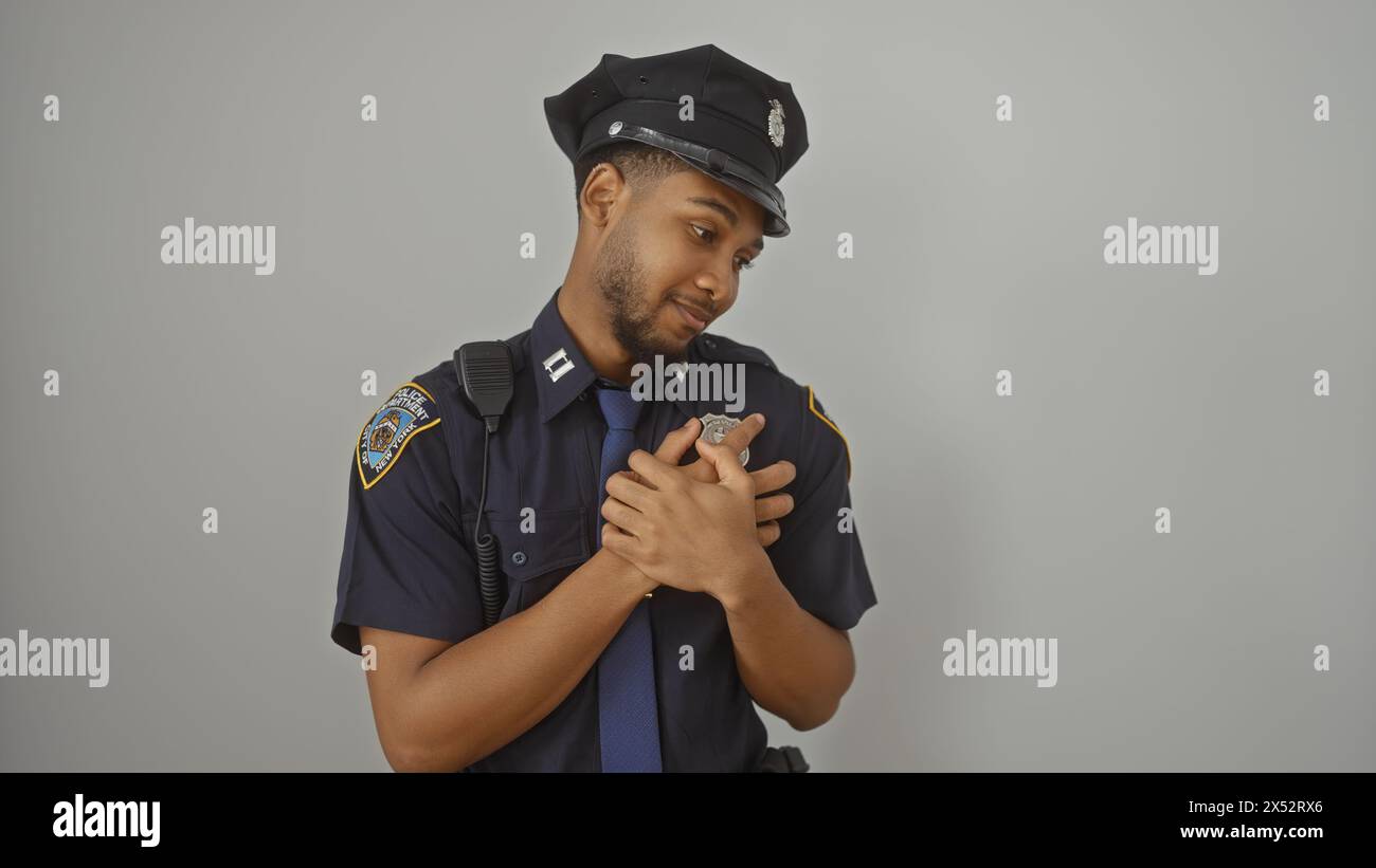 African american police officer with hands on heart, isolated on white ...
