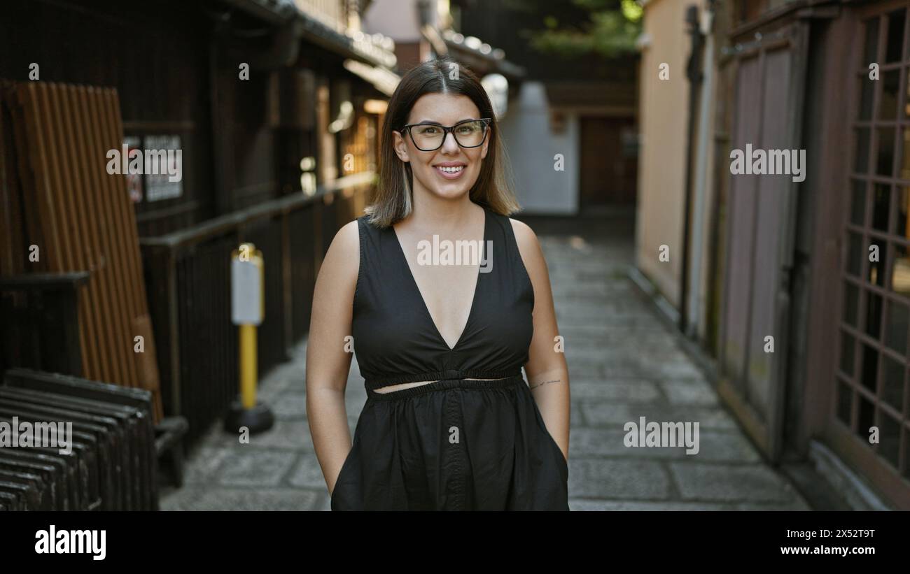 Confident hispanic woman, beautiful and joyful, cheerfully posing with ...