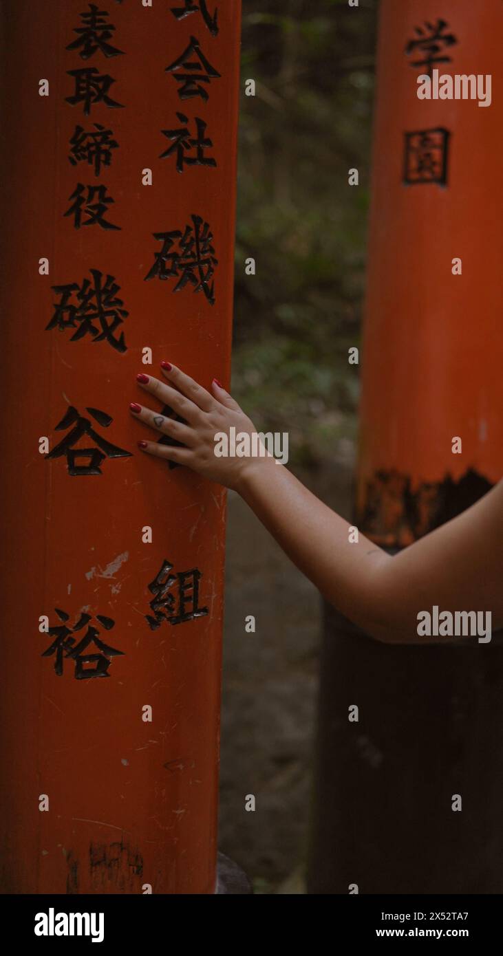 Young woman's reverent walk, walking and touching traditional japanese ...