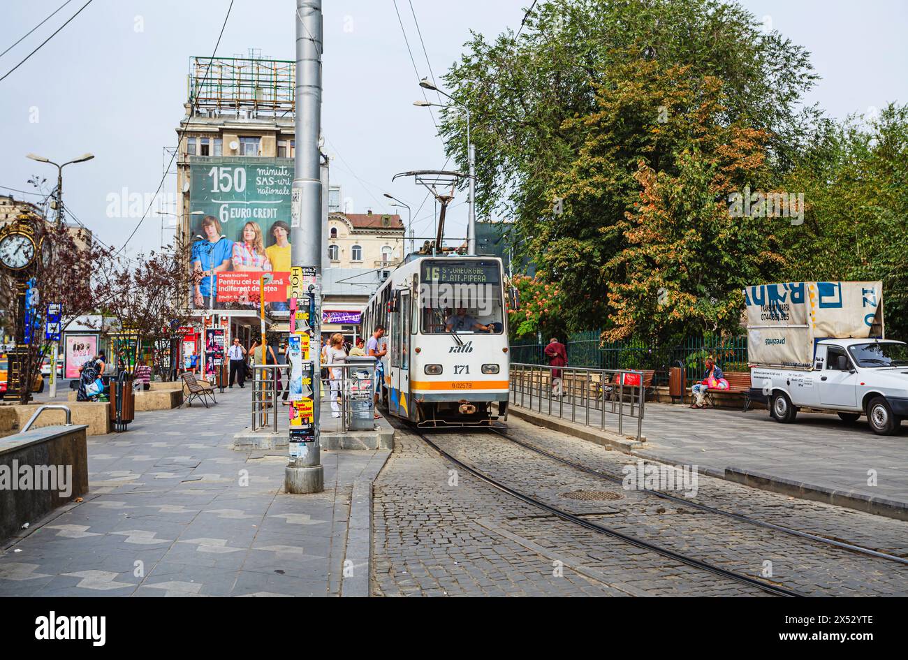 Trams: tramcars and tram rails in cobbled streets of downtown Bucharest ...