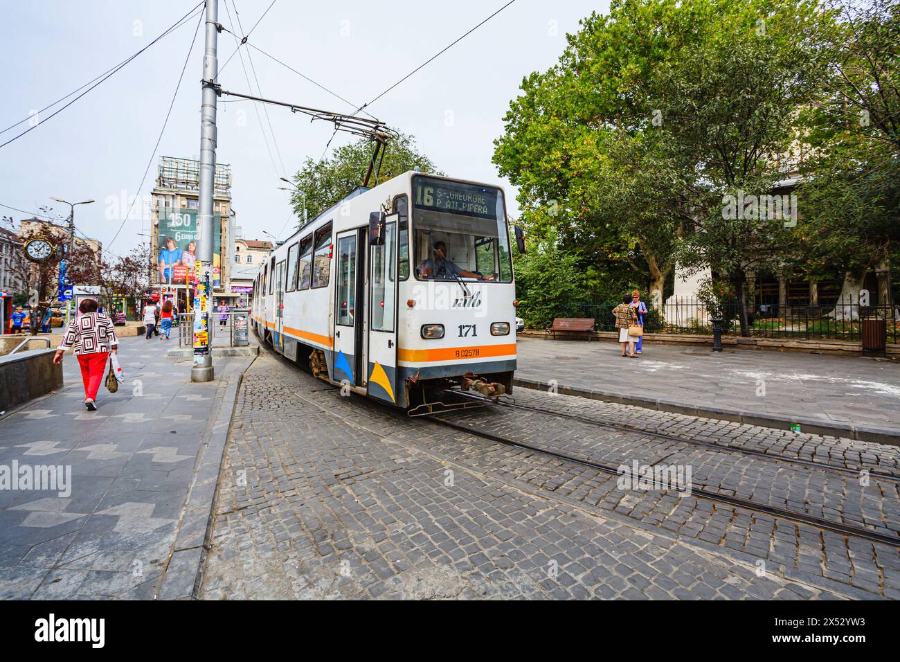 Trams: tramcars and tram rails in cobbled streets of downtown Bucharest ...