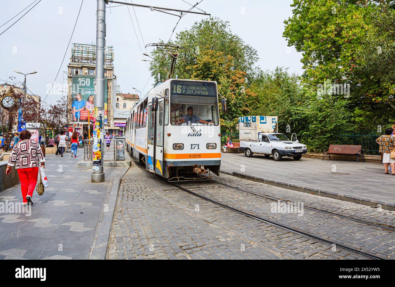 Trams: tramcars and tram rails in cobbled streets of downtown Bucharest ...