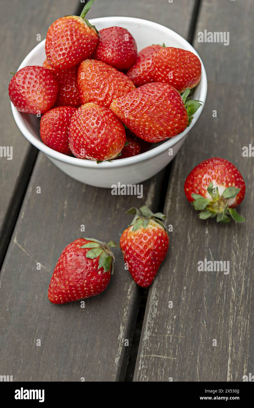 The strawberry is a fruit with a conical or almost round shape, of ...