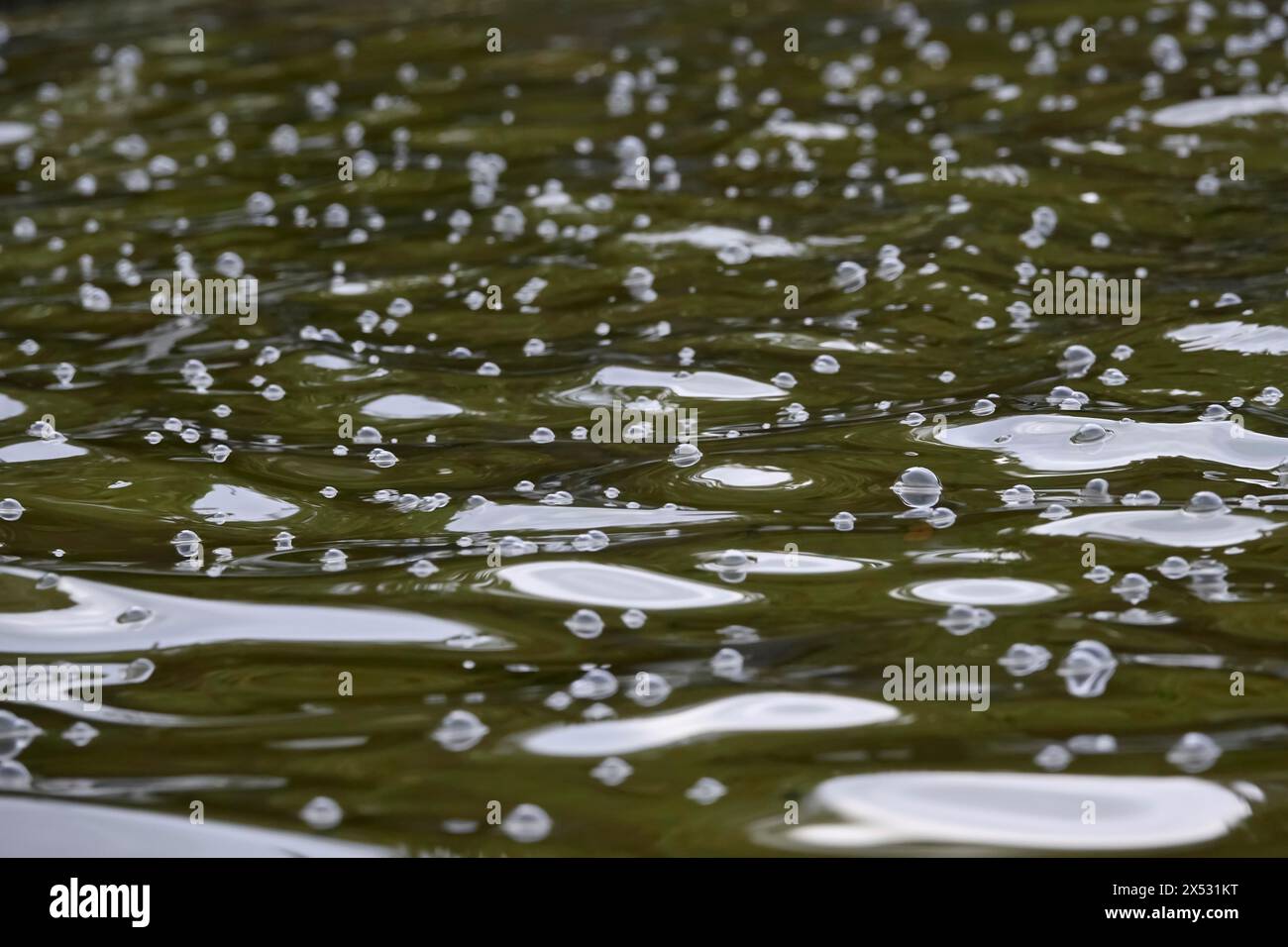 April weather, rain meets a lake, Germany Stock Photo - Alamy