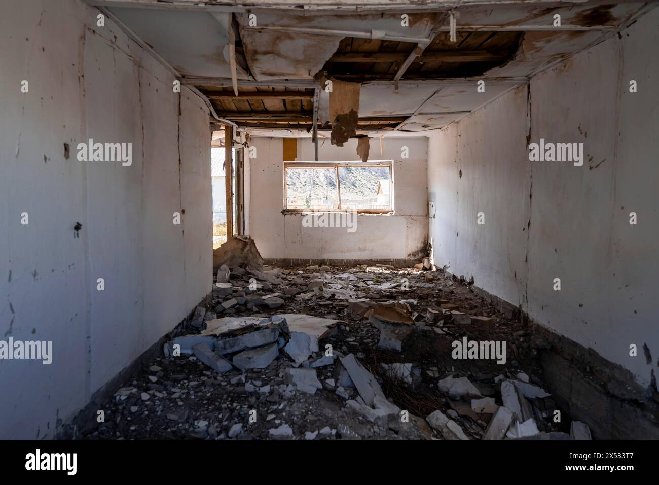 Abandoned destroyed room full of rubble, ghost town, Engilchek, Tian ...