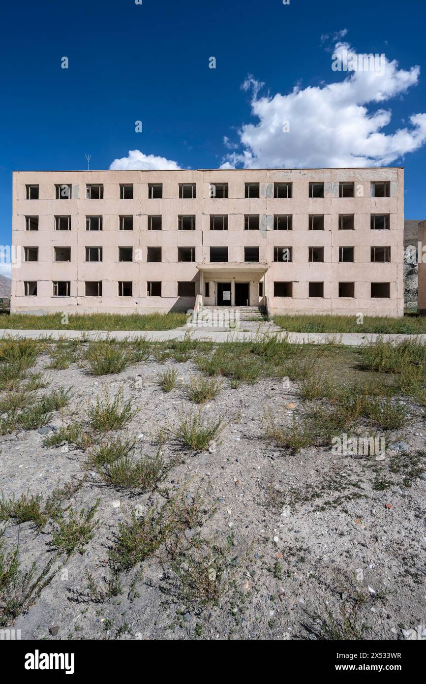 Abandoned destroyed residential building, old Soviet block of flats in ...