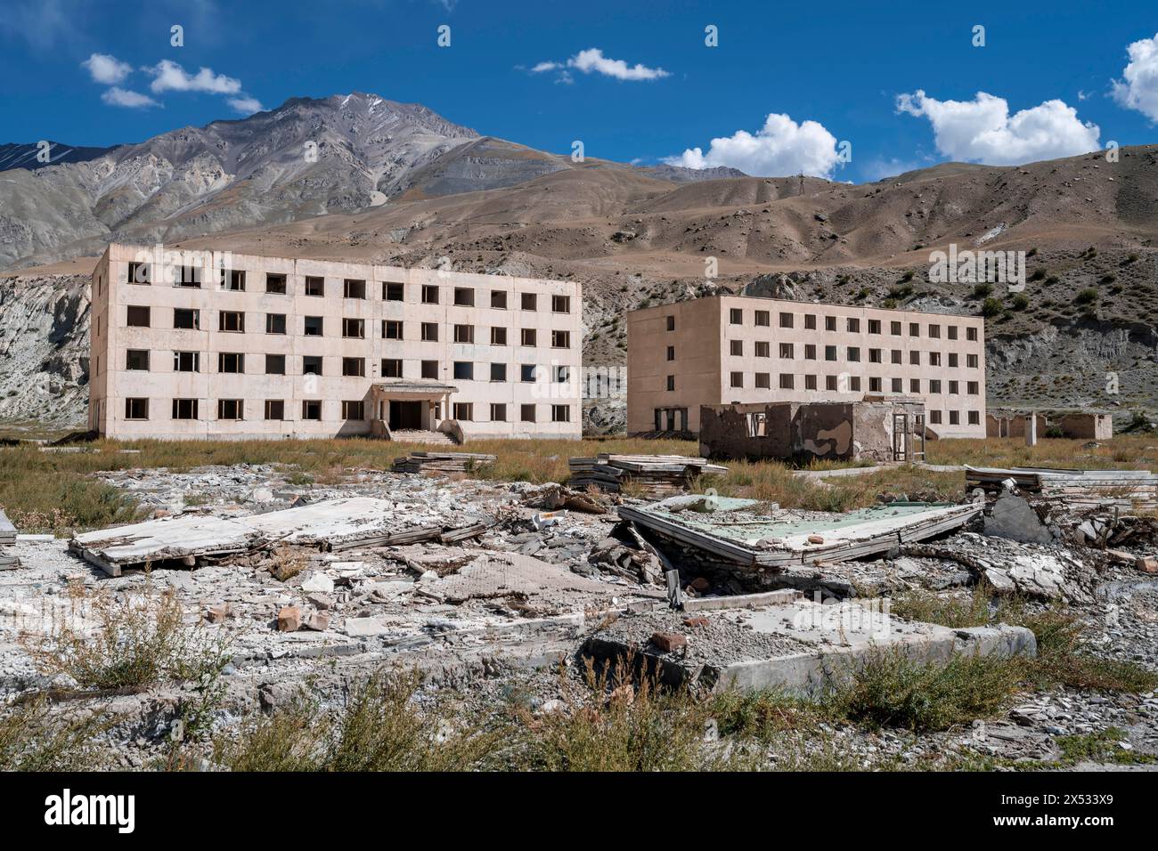 Abandoned, destroyed residential buildings, old Soviet apartment blocks ...