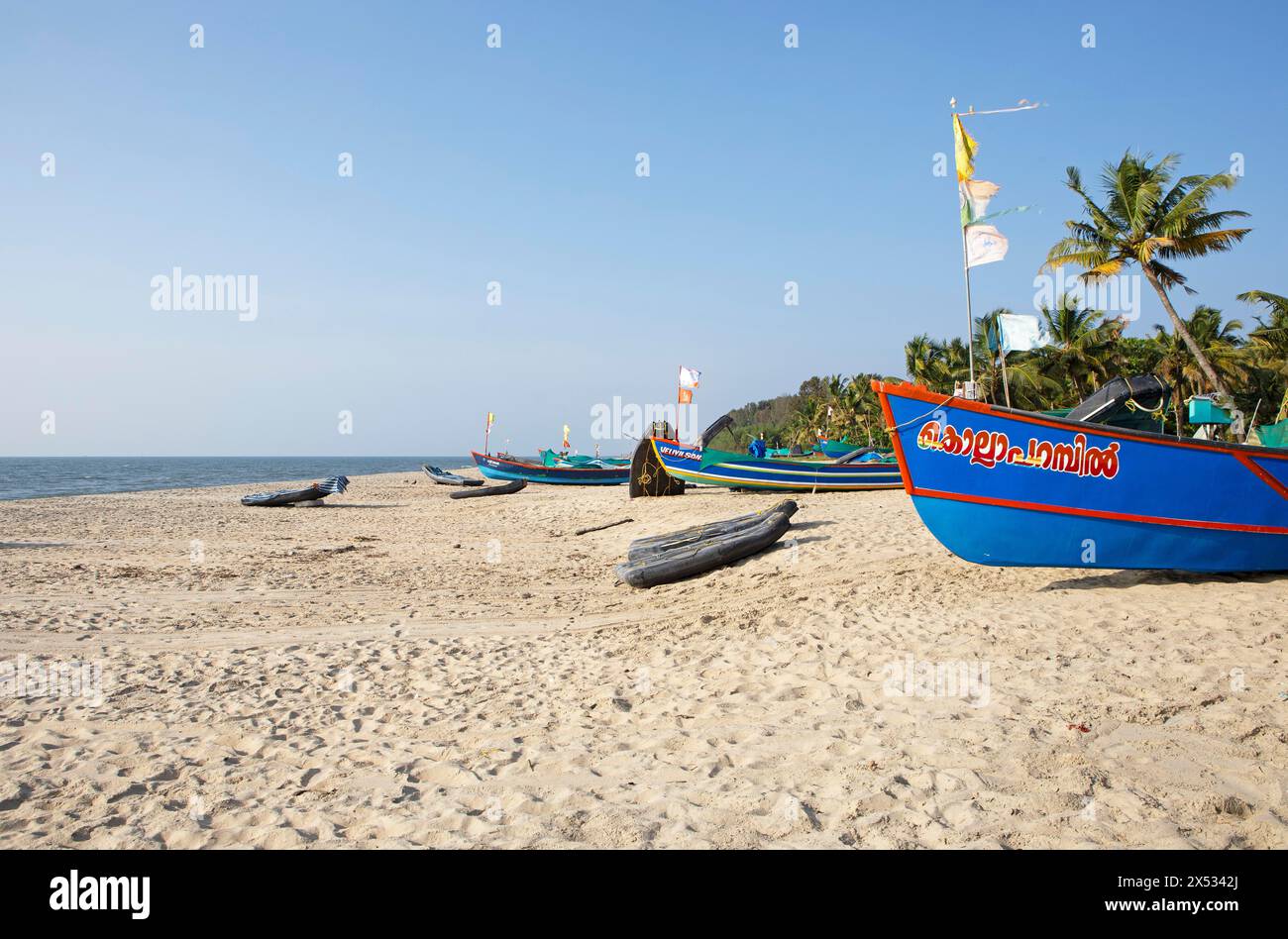 Colourful fishing boats on Marari Beach, Mararikulam, Alappuzha ...
