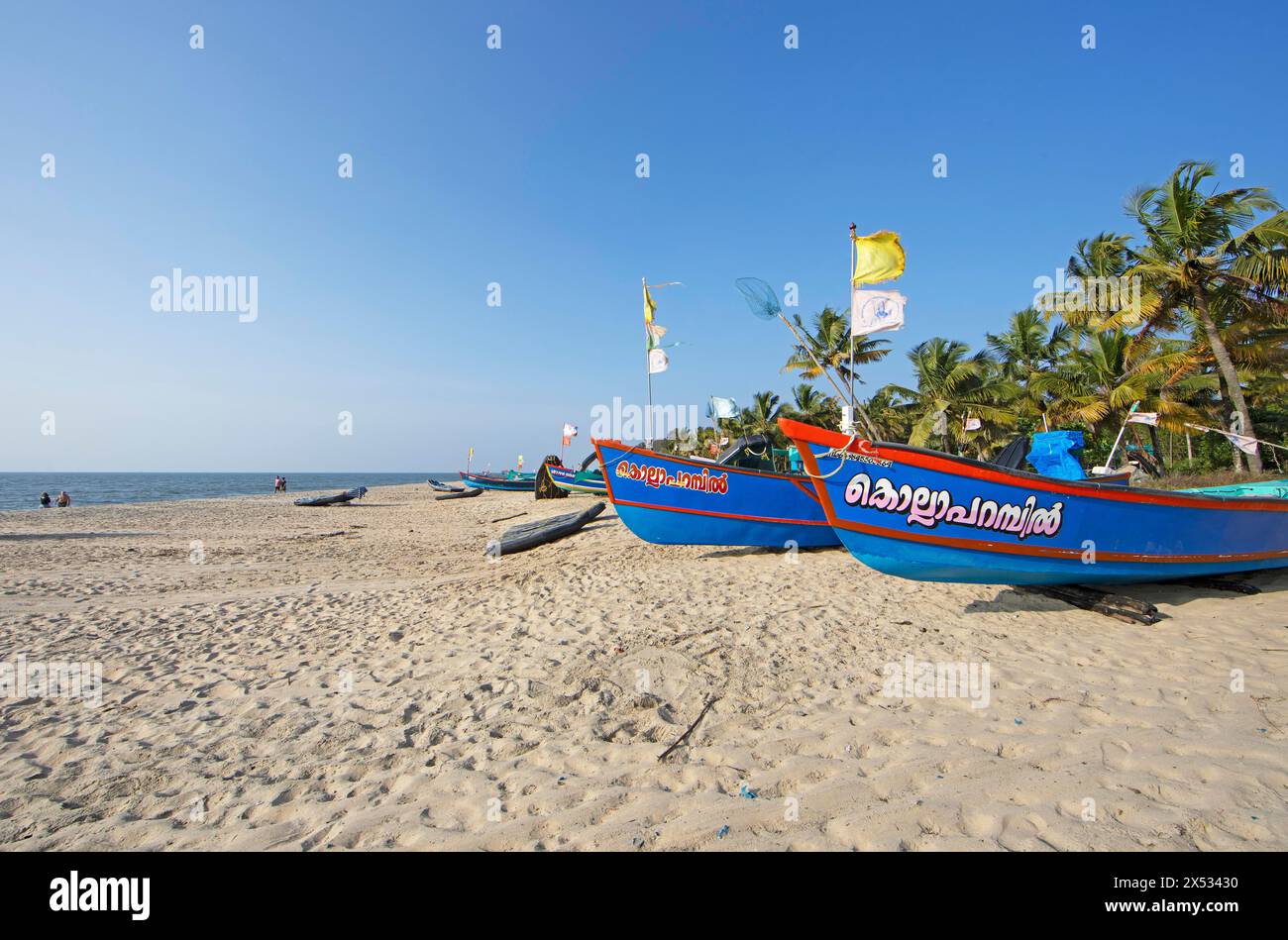 Colourful fishing boats on Marari Beach, Mararikulam, Alappuzha ...