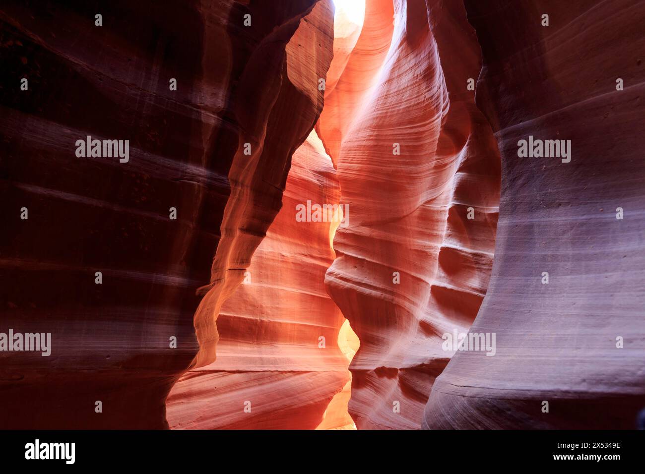 Rock arch in the canyon illuminated from above creates a soft play of ...