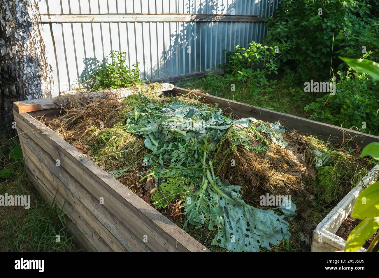 A compost heap in the village. Compost bin in the village. A compost ...