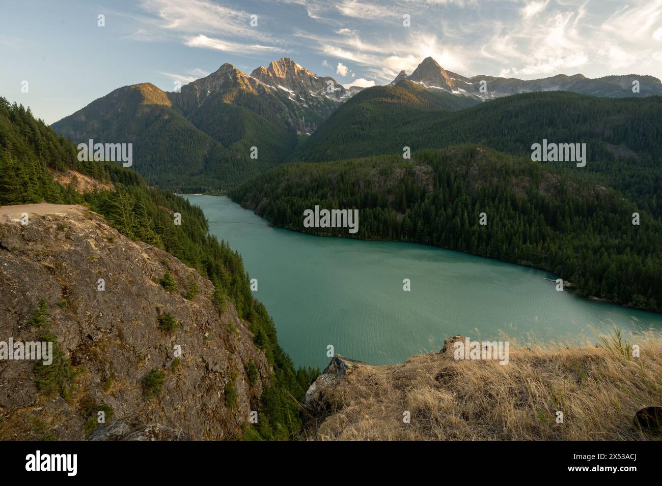 Grass Covered Cliffs Make A Steep Drop Down to Diablo Lake Below And ...