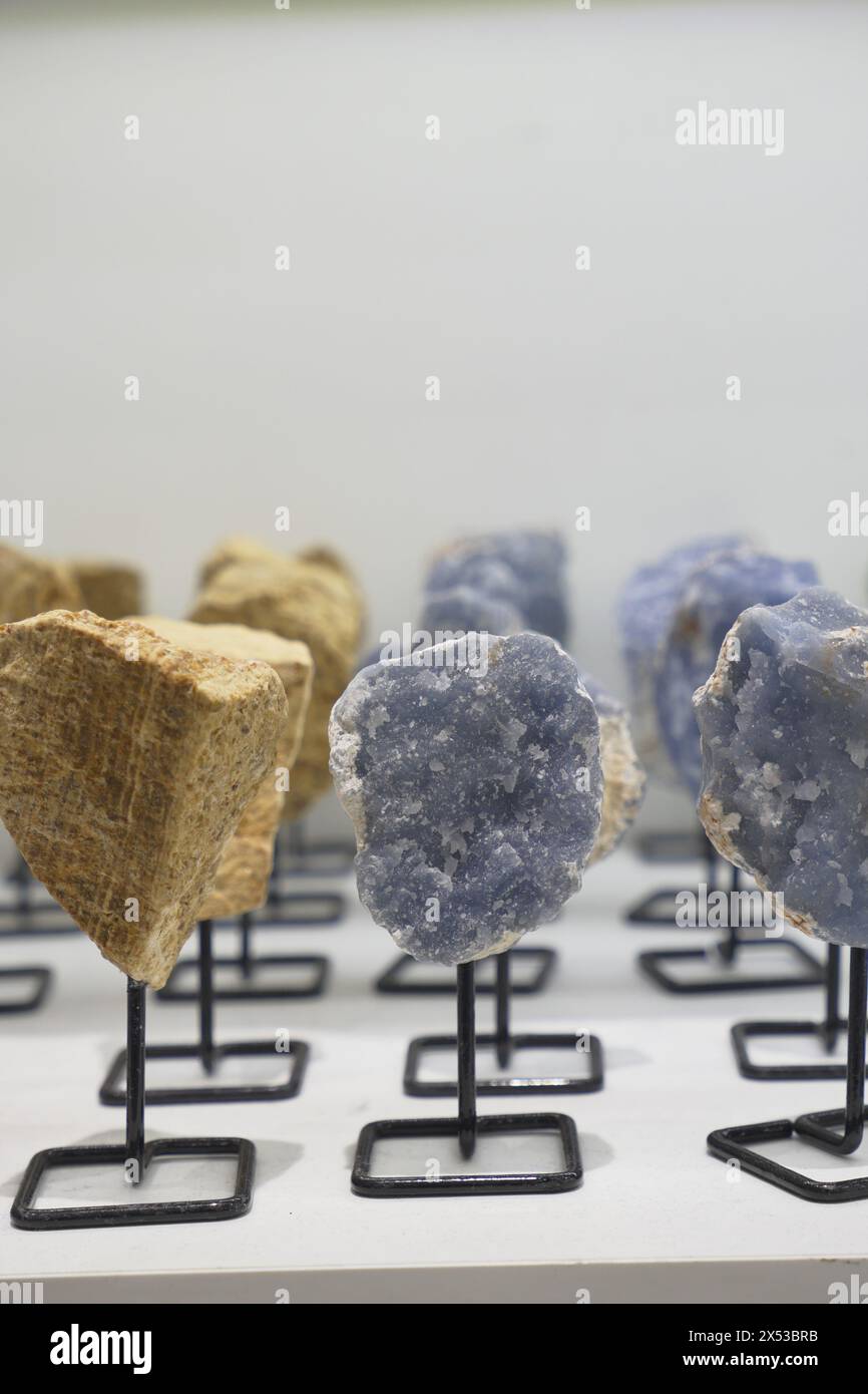 Various rocks are showcased on a table for art display Stock Photo - Alamy