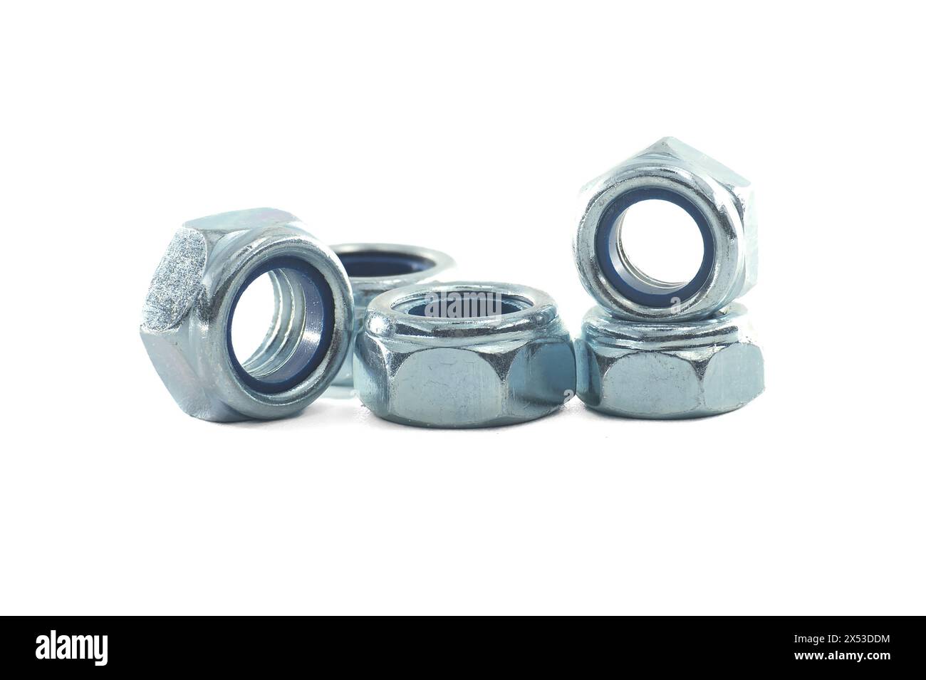 Zinc plated self locking nylon Insert hexagon nuts isolated on white ... Zinc plated self locking nylon Insert hexagon nuts isolated on white ...