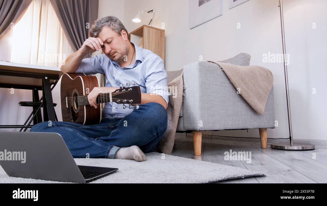 Guitar learning. Educational problem. Virtual lesson. Upset displeased ...