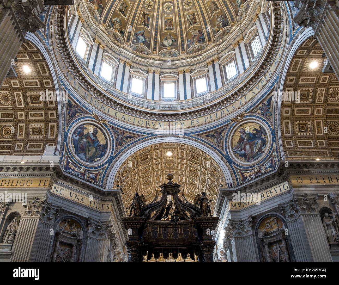 Detail of the dome of Saint Peter’s Basilica, and St. Peter's Baldachin, located in the central ...