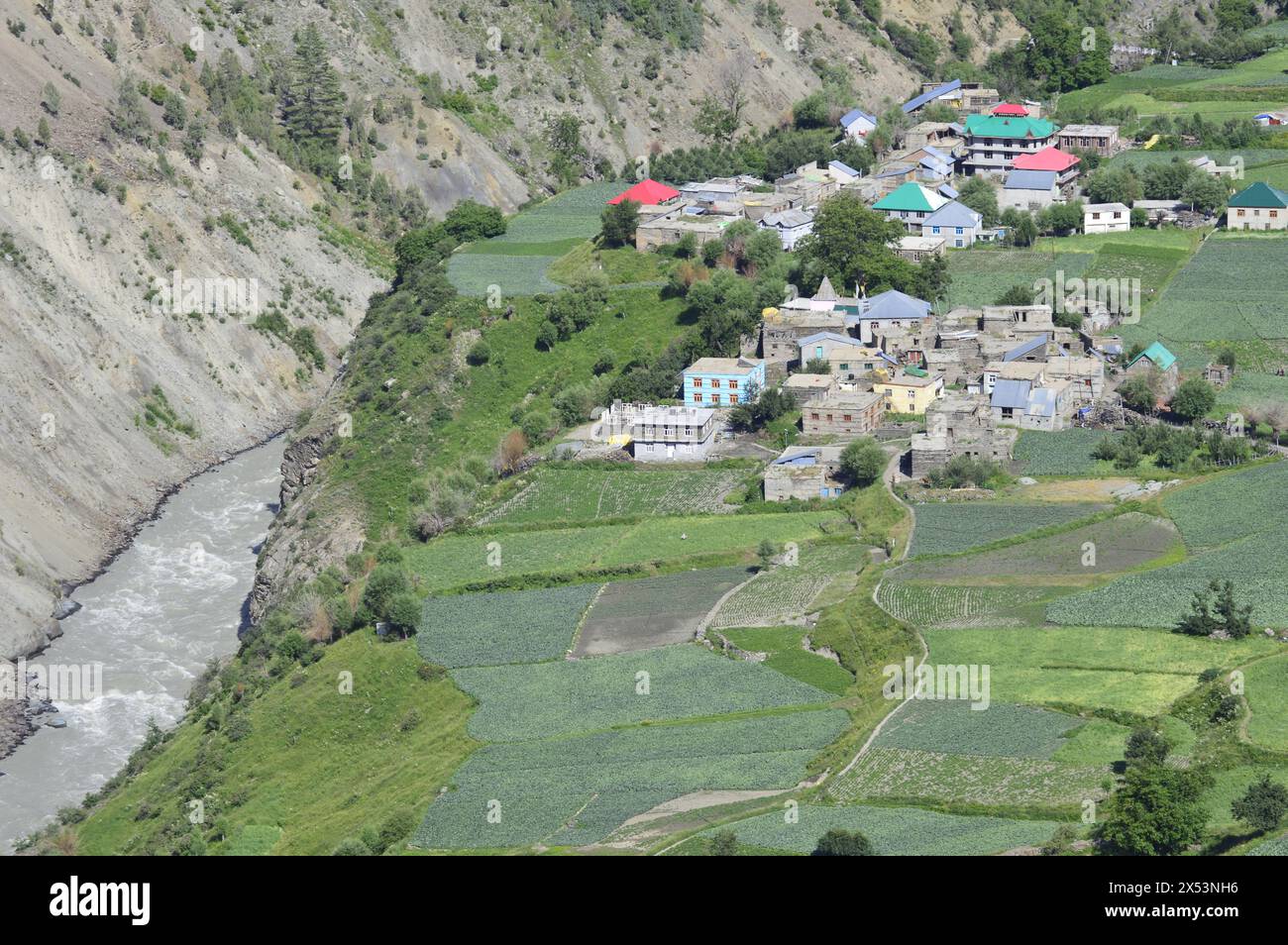 scenic view of a village in lahaul valley near udaipur on the bank of ...
