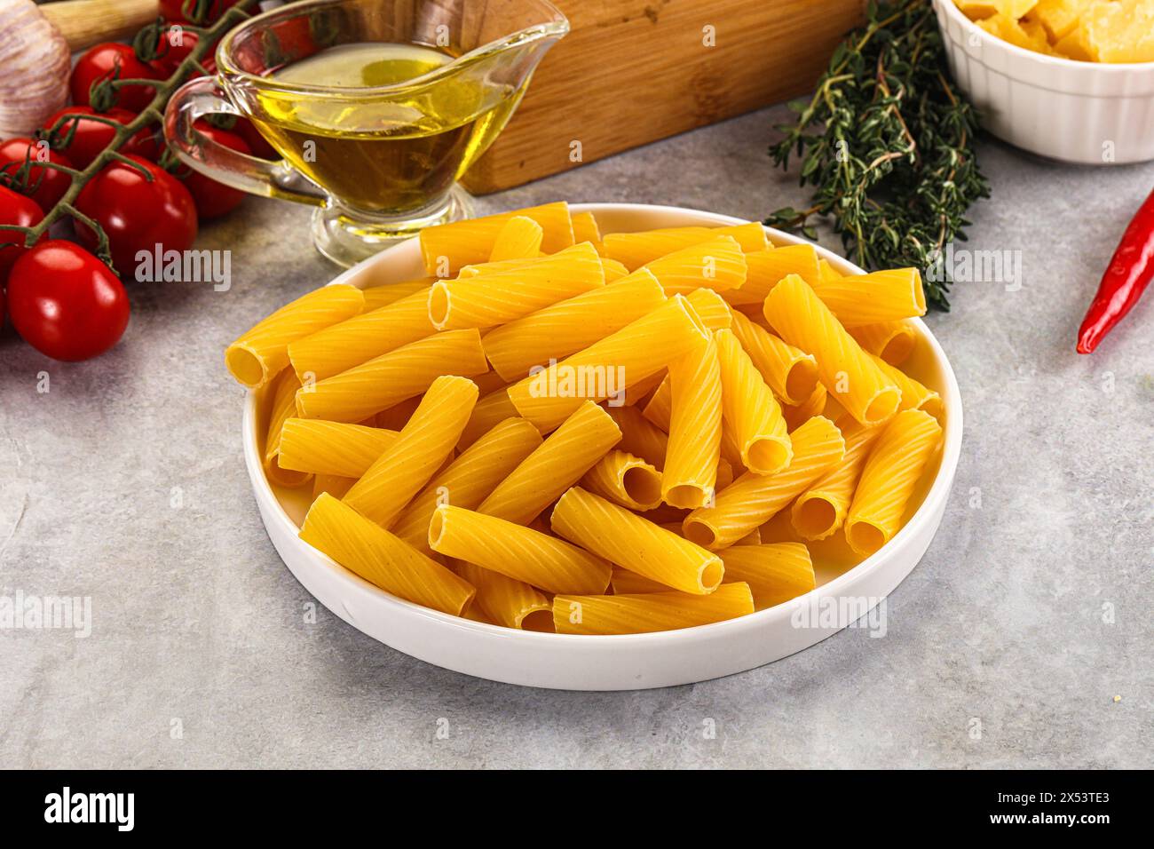 Italian cuisine - raw dry tortiglioni pasta Stock Photo - Alamy