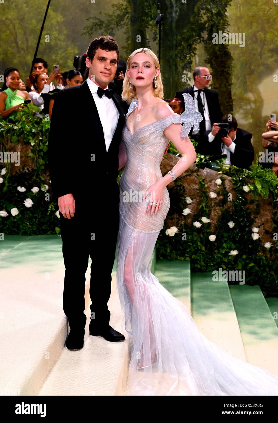 Gus Wenner and Elle Fanning attending the Metropolitan Museum of Art ...