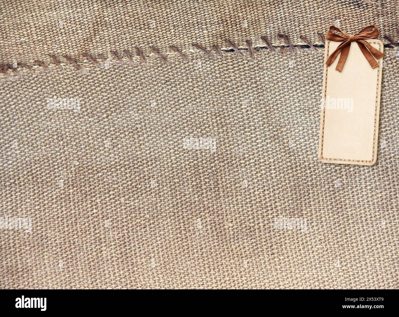 Organic eco paper price tag with bow on old burlap. Eco-friendly ...