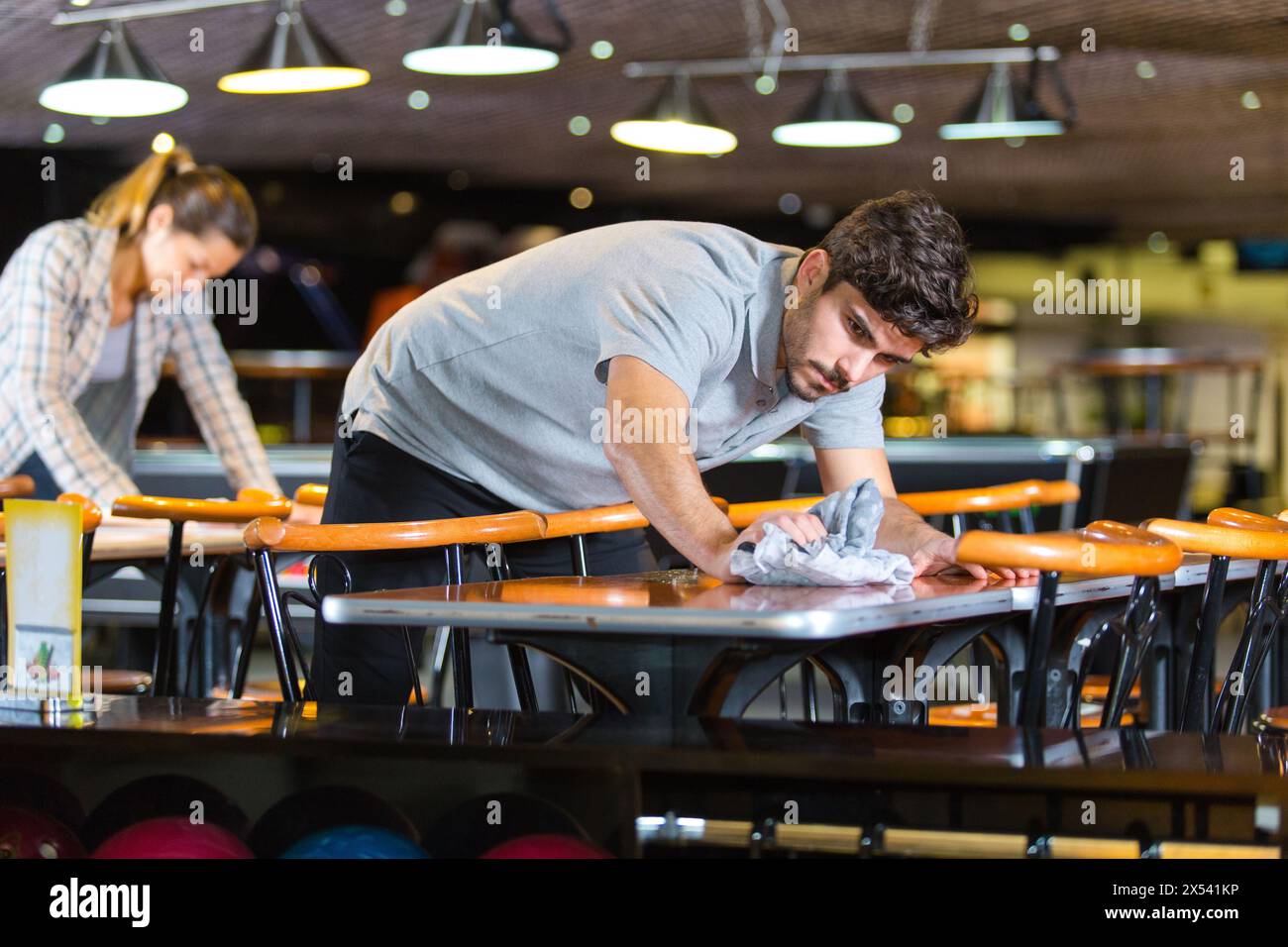 young man cleaning cafe Stock Photo - Alamy