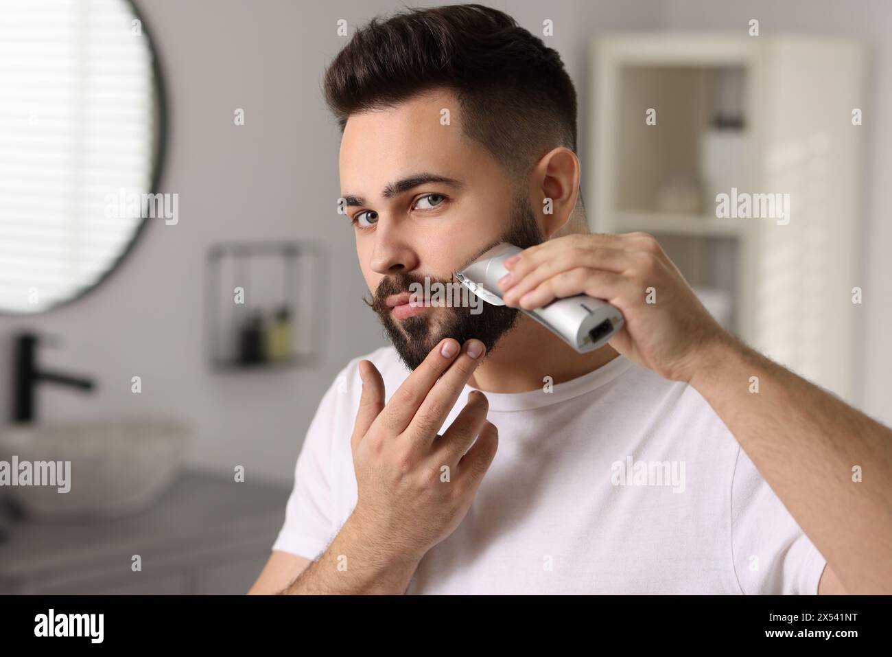 Male shaving trimming beard hi-res stock photography and images - Alamy