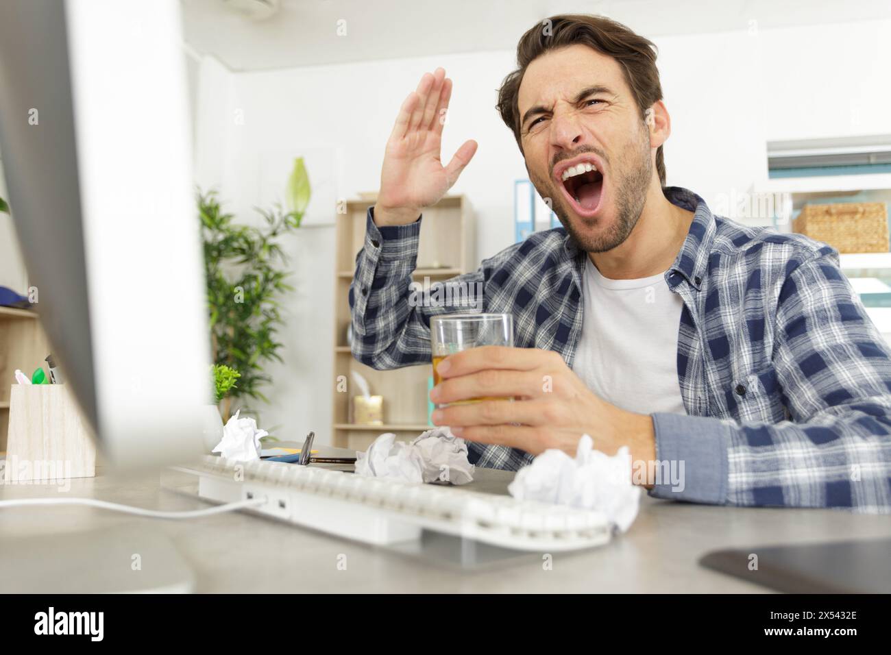 angry man shouting at his computer Stock Photo - Alamy