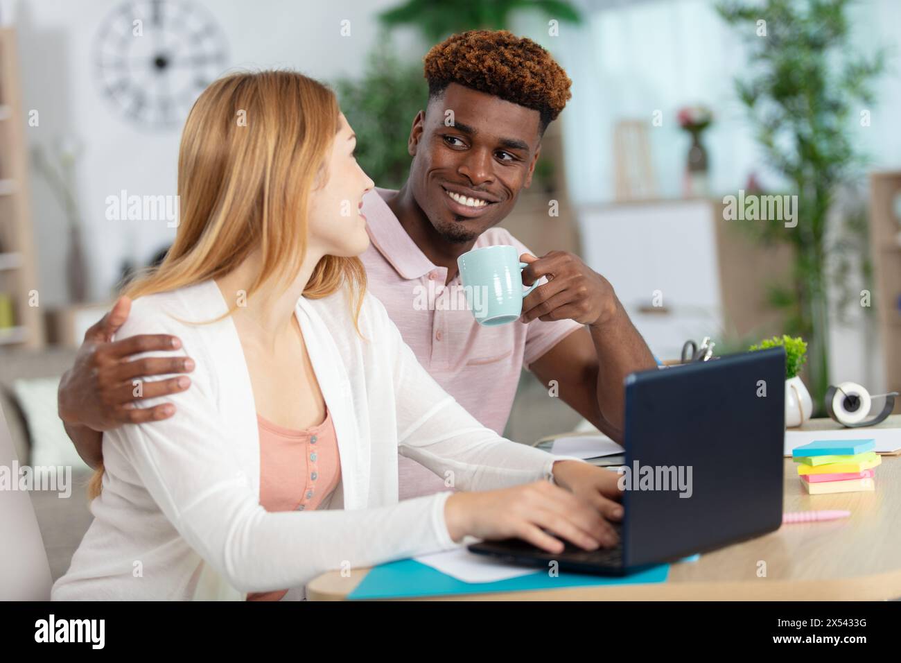 happy couple check paper bills paying online Stock Photo - Alamy