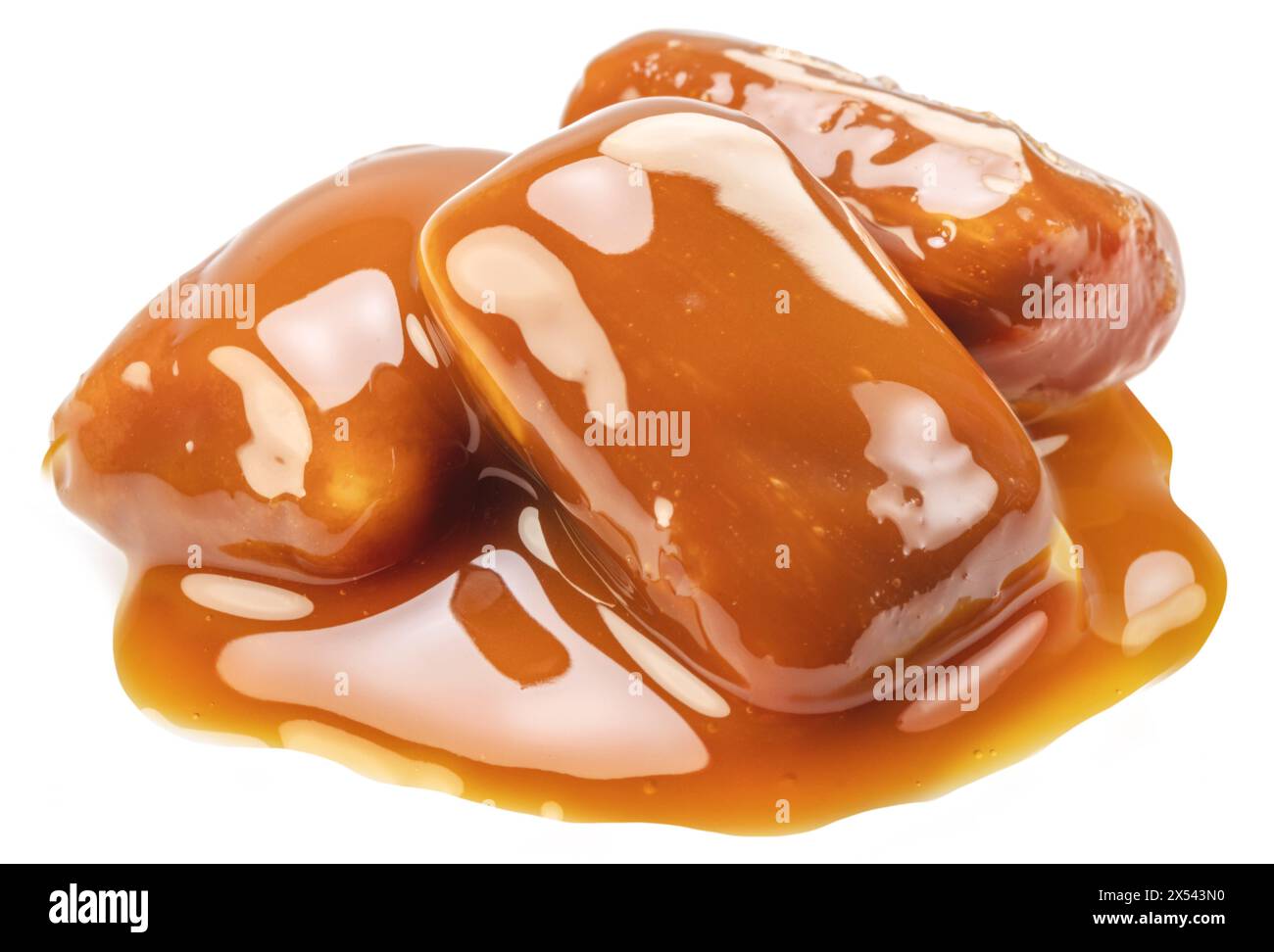 Caramel candies covered with melt caramel isolated on white background ...