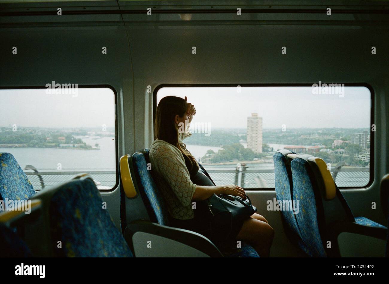 Train passenger looking out the window Stock Photo - Alamy
