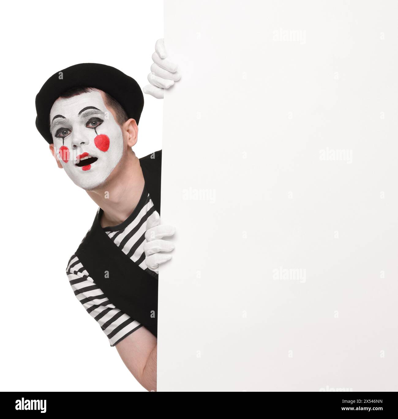 Funny mime artist peeking out of blank poster on white background Stock ...