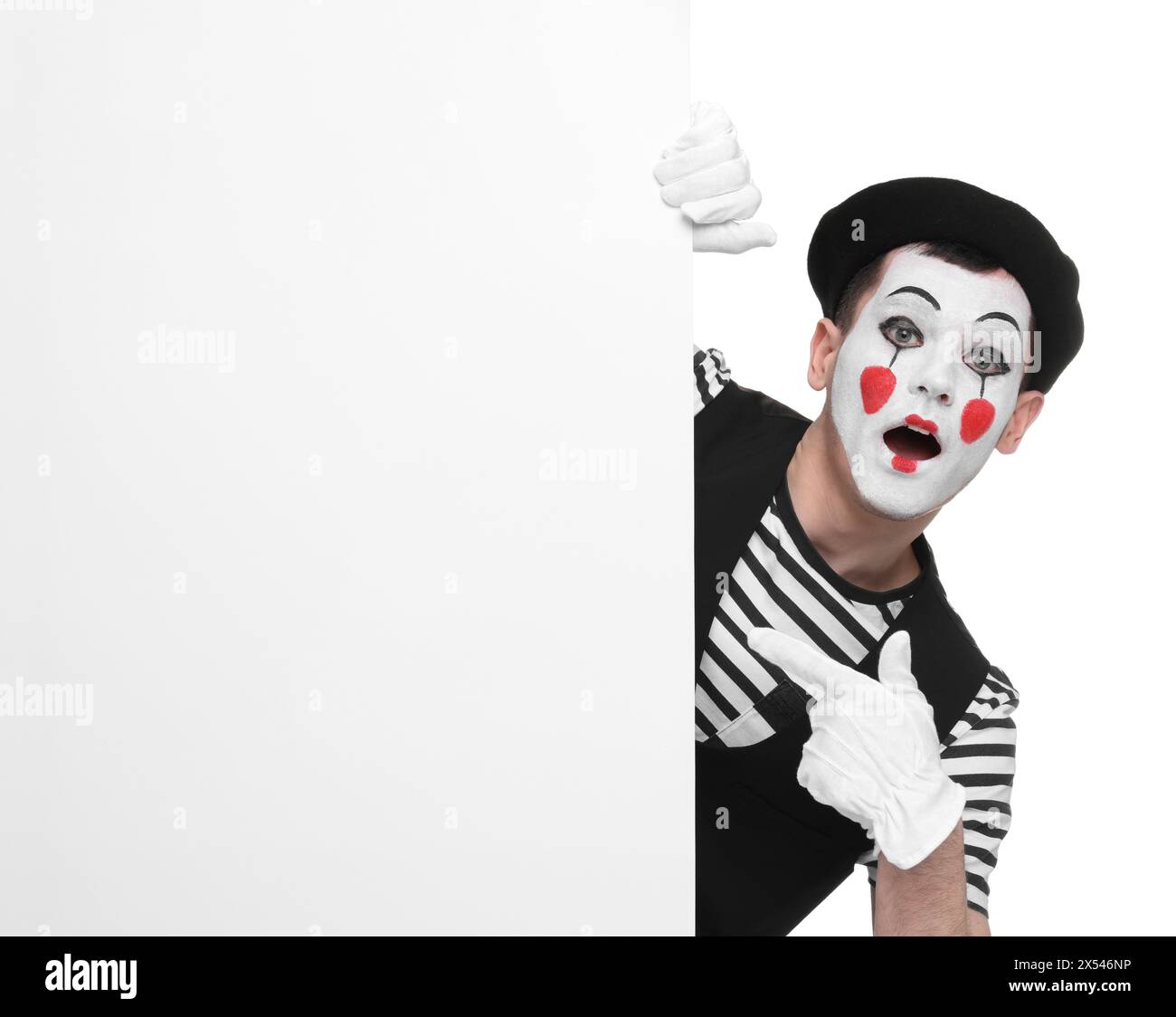 Funny mime artist peeking out of blank poster on white background Stock ...