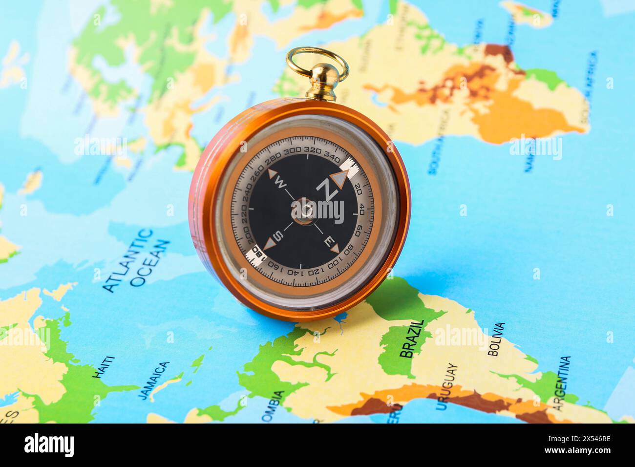 Compass on world map hi-res stock photography and images - Alamy