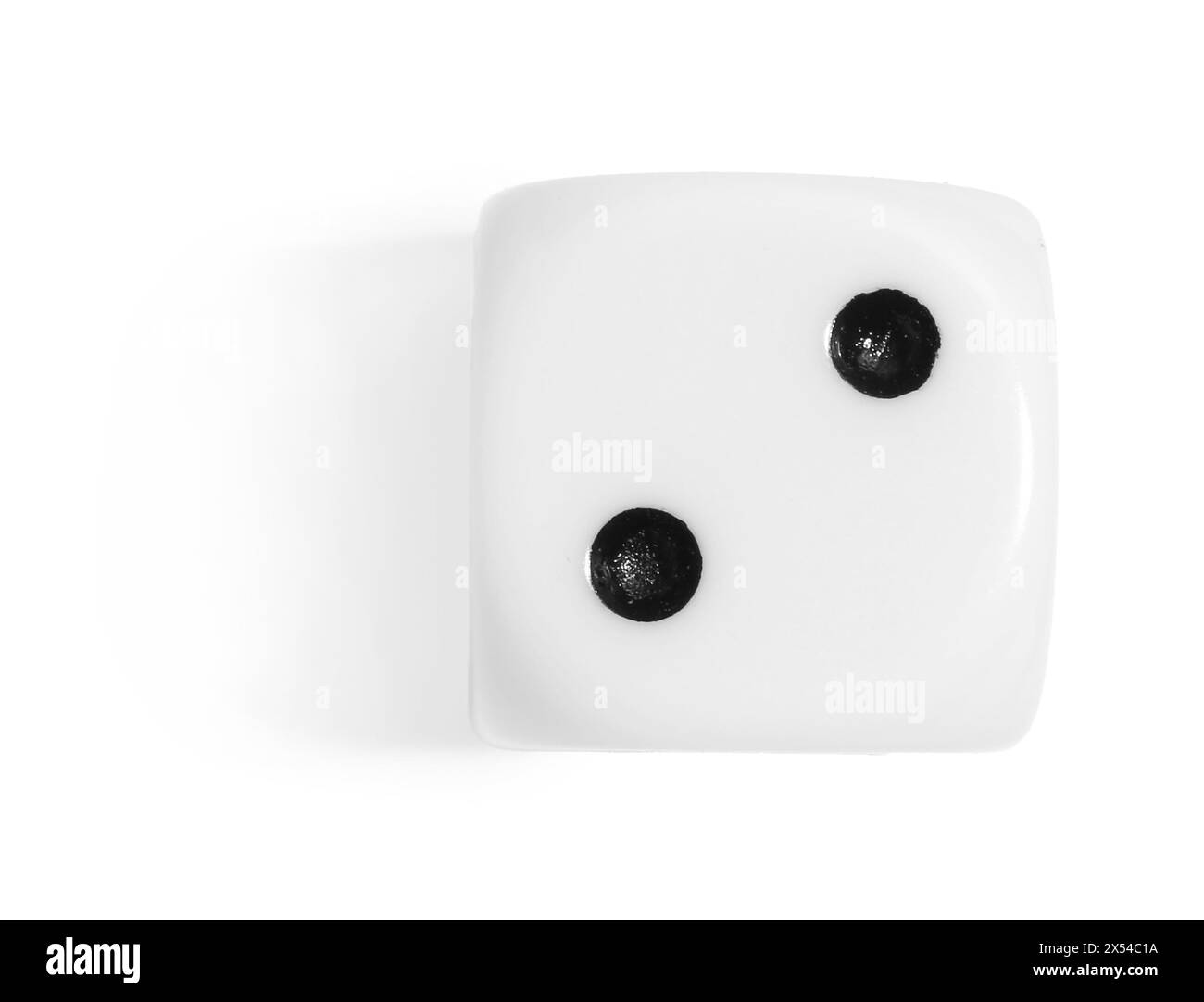 Rolling dice on white background Black and White Stock Photos & Images ...