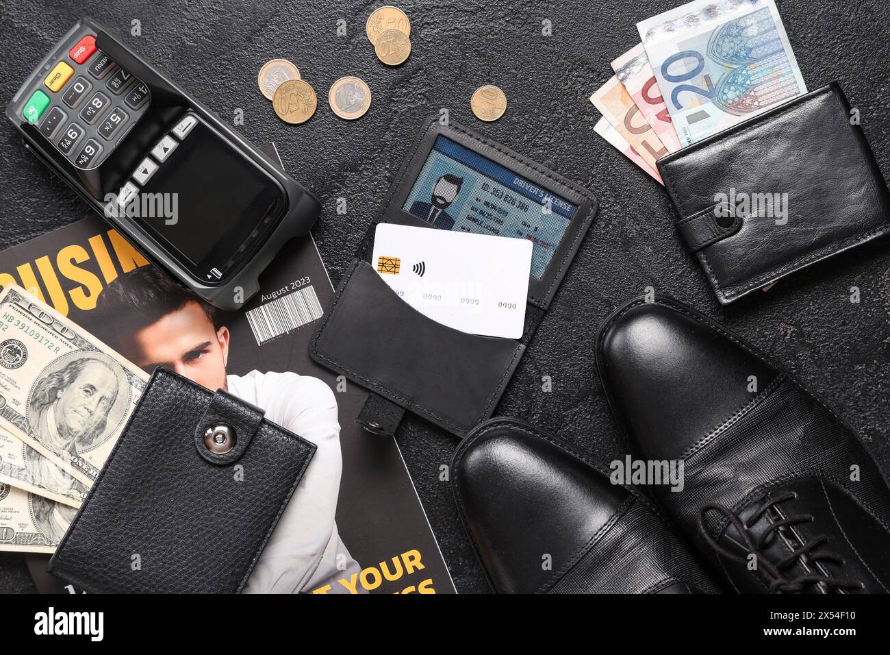Black credit holder, cards, wallet, male shoes, payment terminal and ...